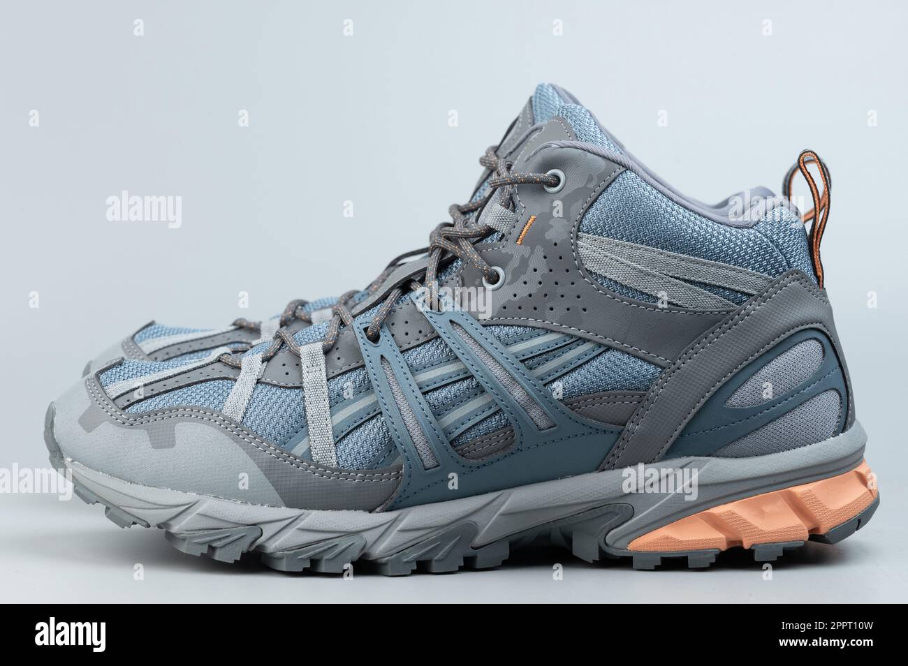 Side view of strong durable grey shoes isolated on studio background ...