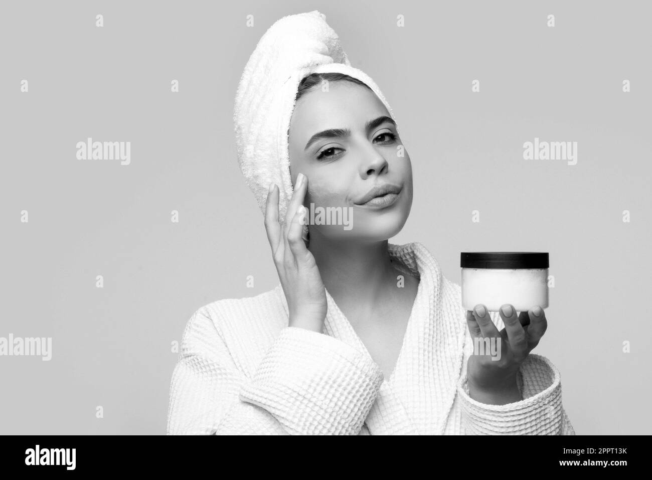 Beautiful young woman with clean fresh skin touch own face. Facial ...