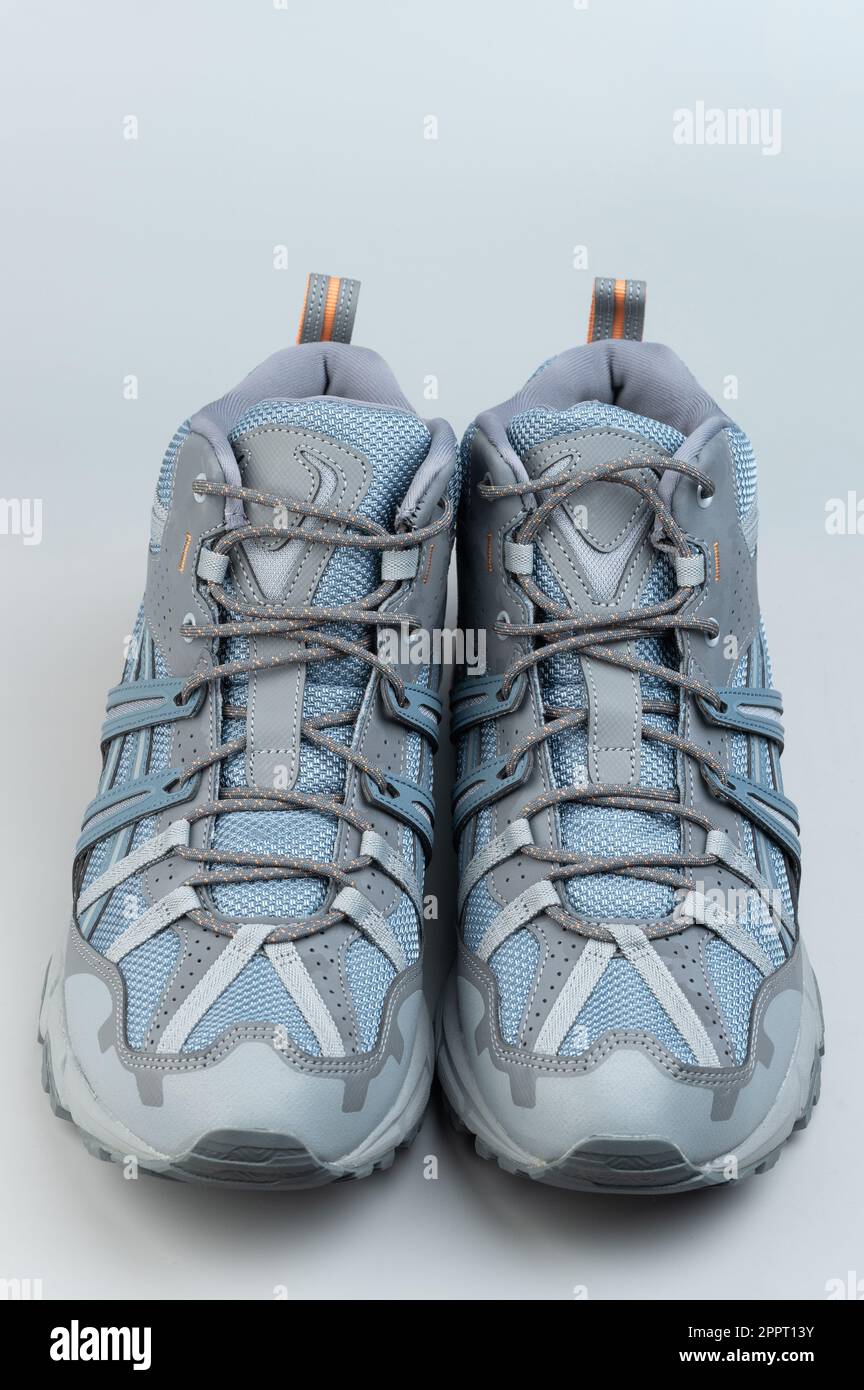 Front view of hiking strong shoes isolated on gray studio background ...
