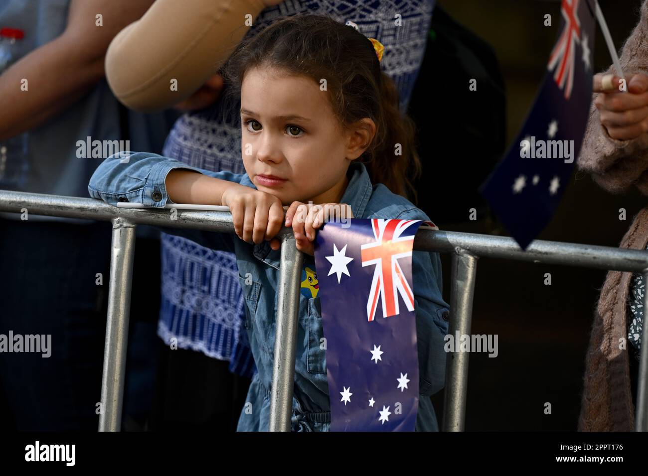 A young spectator watches on during the ANZAC Day March in Sydney ...