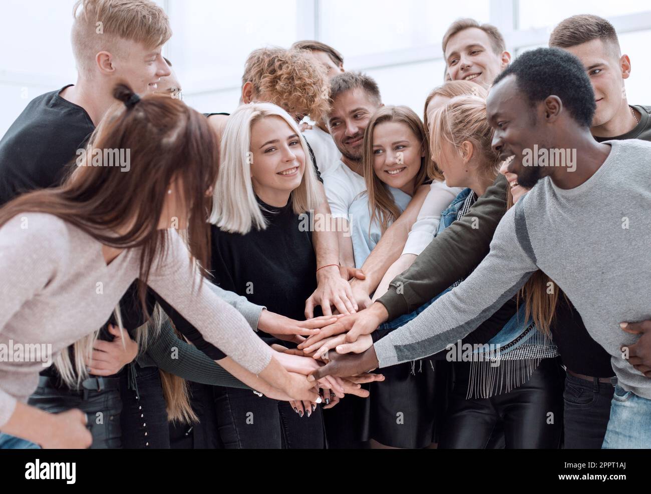 Hands stack group students hi-res stock photography and images - Alamy