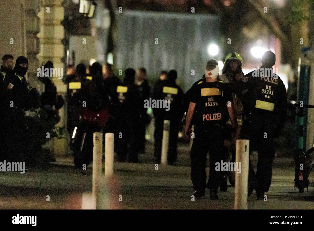 Berlin, Germany. 25th Apr, 2023. A police officer wears a head bandage ...