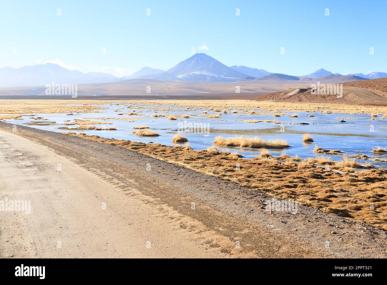 Chilean landscape, dirt road and Licancabur volcano. Chile panorama ...