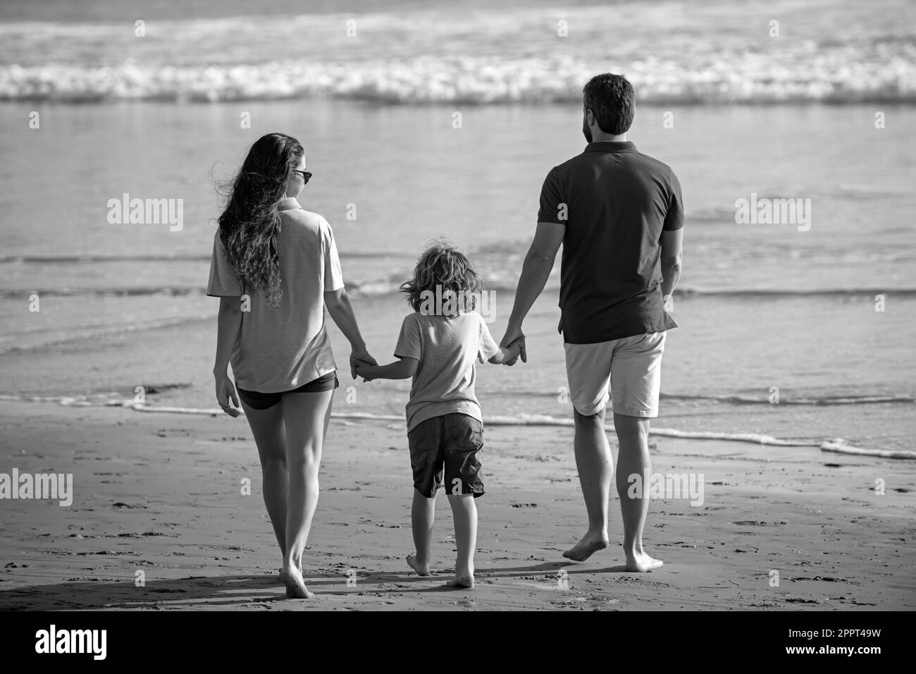 Mother and son walk and back view Black and White Stock Photos & Images ...