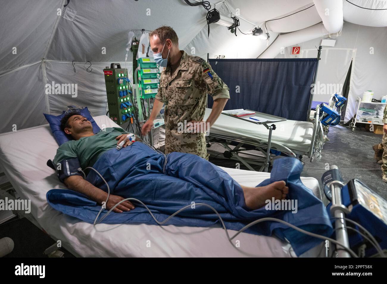 24 April 2023, Turkey, Altinözü: A Bundeswehr doctor stands at the ...