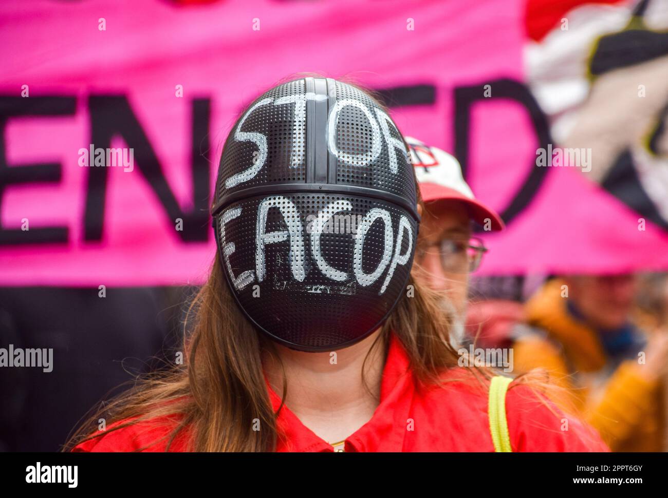 London, UK. 24th Apr, 2023. A protester wears a Stop EACOP (East ...