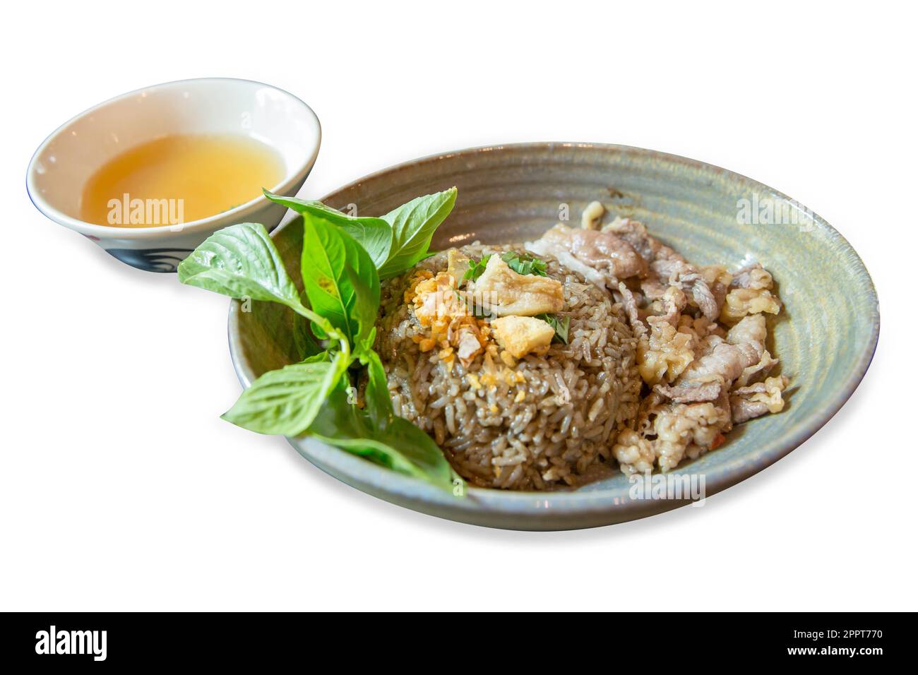 Die cut of Beef fried rice with fresh egg and green basil on white ...