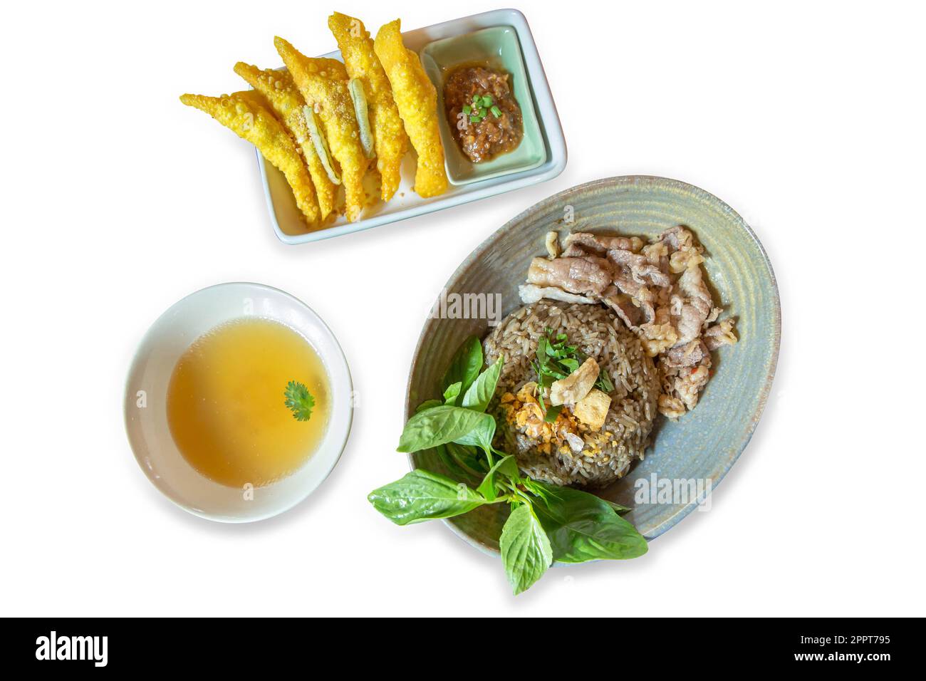 Die cut of Beef fried rice with fresh egg and green basil on white ...