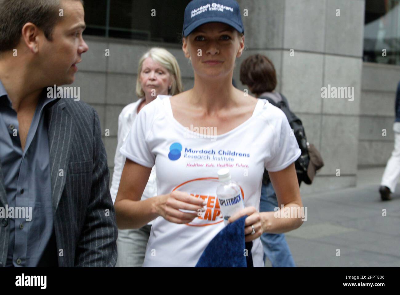 Lachlan Murdoch walks a perspirating Sarah Murdoch to the Westin Hotel ...