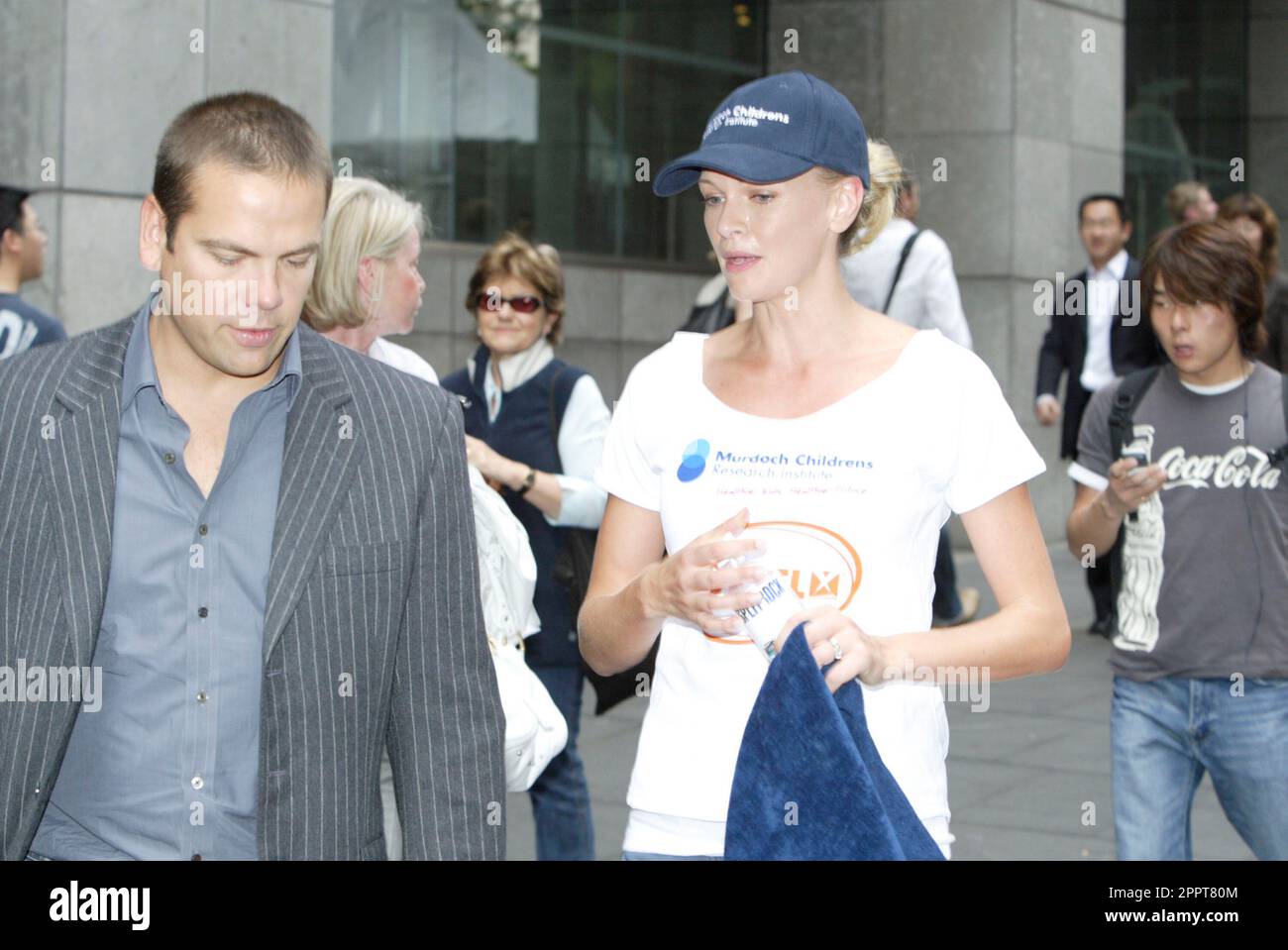 Lachlan Murdoch walks a perspirating Sarah Murdoch to the Westin Hotel ...