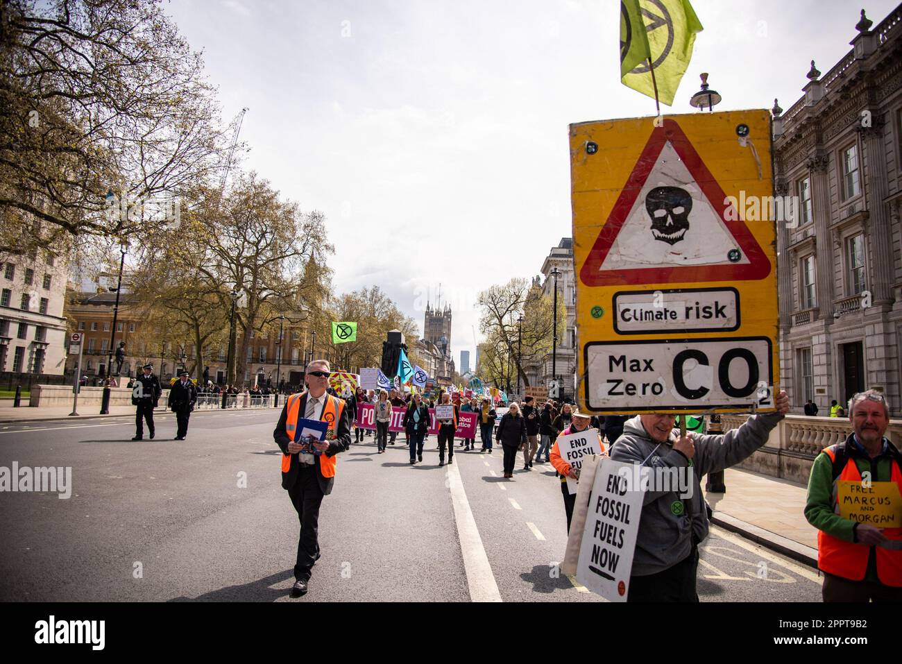 London, UK. 24th Apr, 2023. A protestor holds a placard expressing his ...