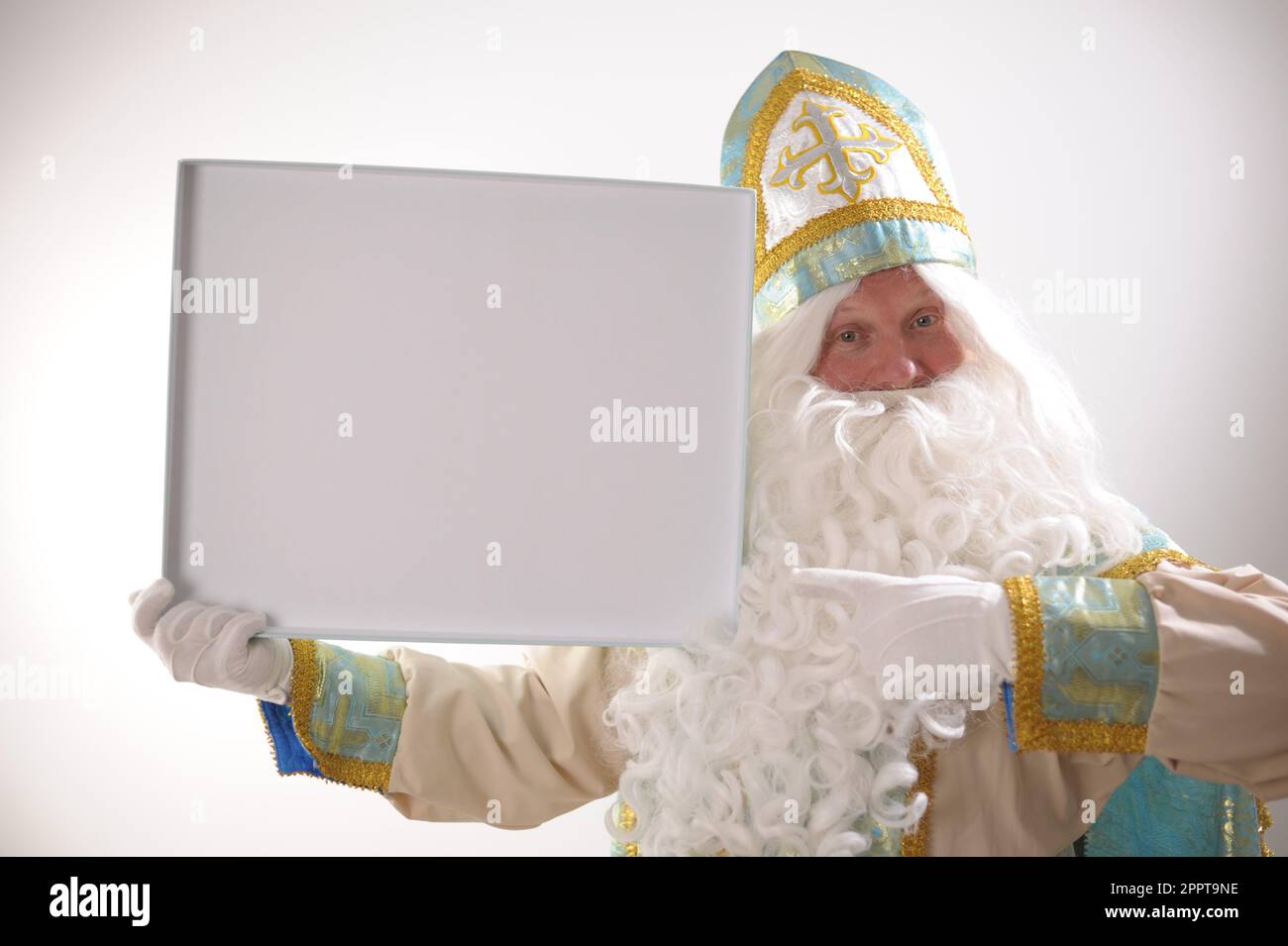 Santa is surprised as he is caught in the act of stuffing a child's ...