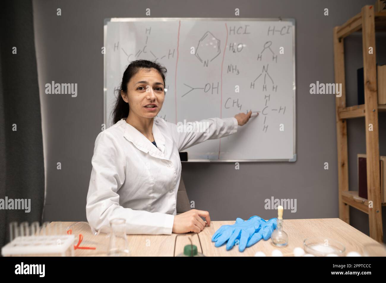 Chemistry teacher having online class and showing molecular model on ...