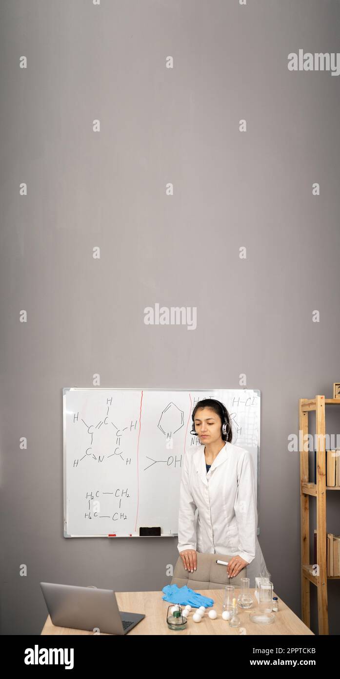 Modern education remotely. Cheerful hispanic woman having video call with her class to teach ...