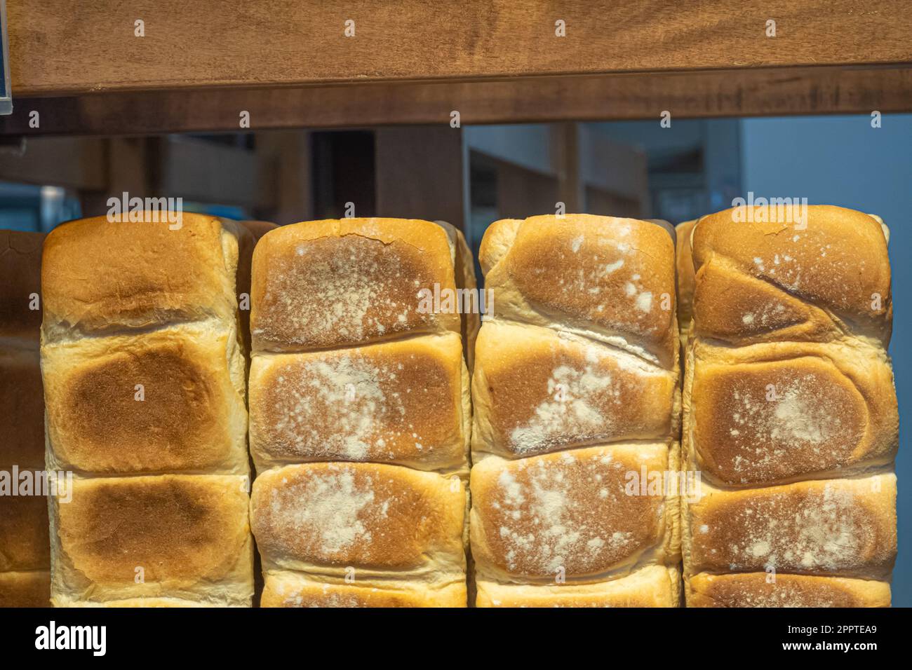 Loaves of bread on display in bakery Stock Photo - Alamy