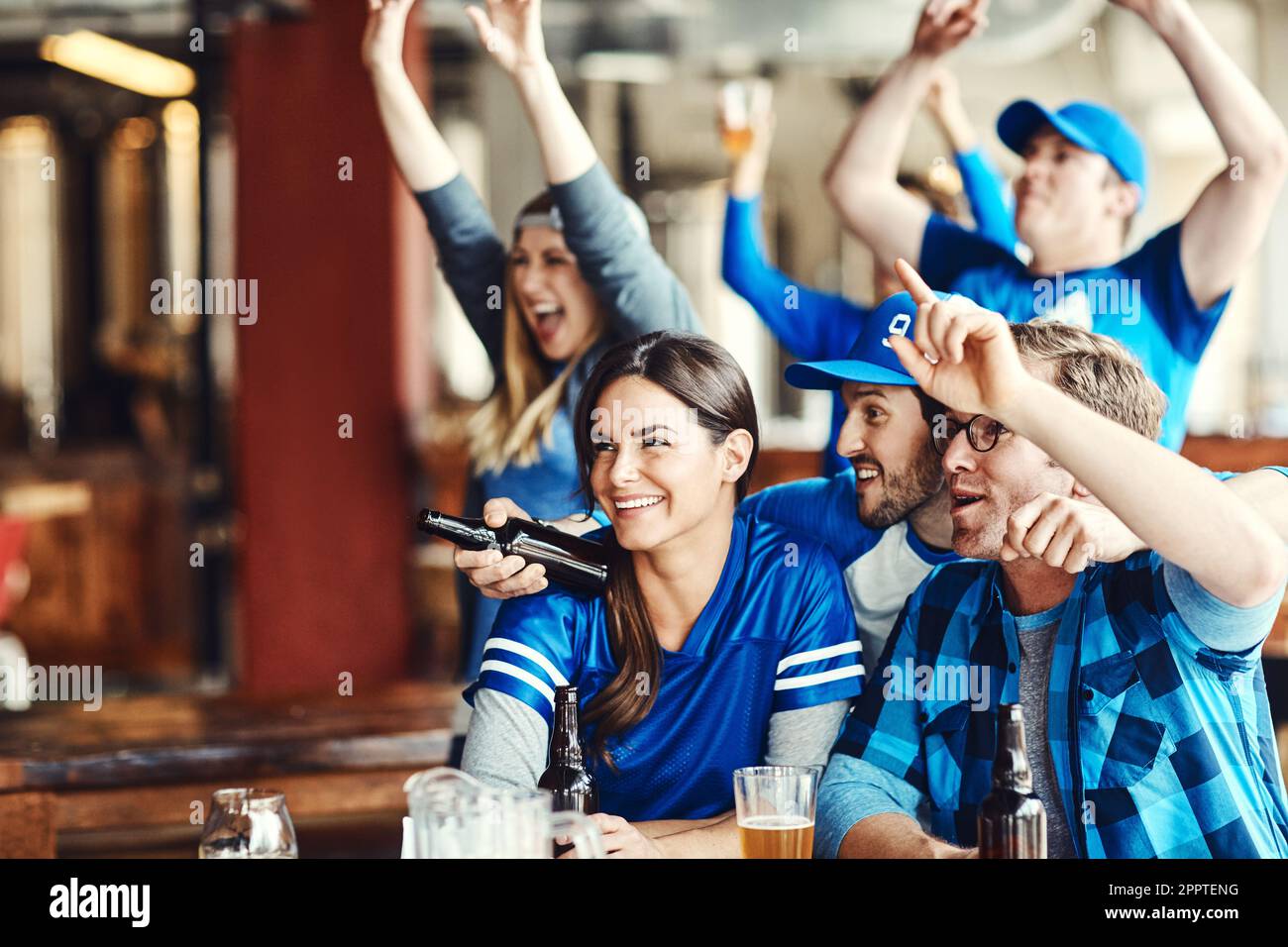 Our team never disappoints. A group of excited friends cheering on ...