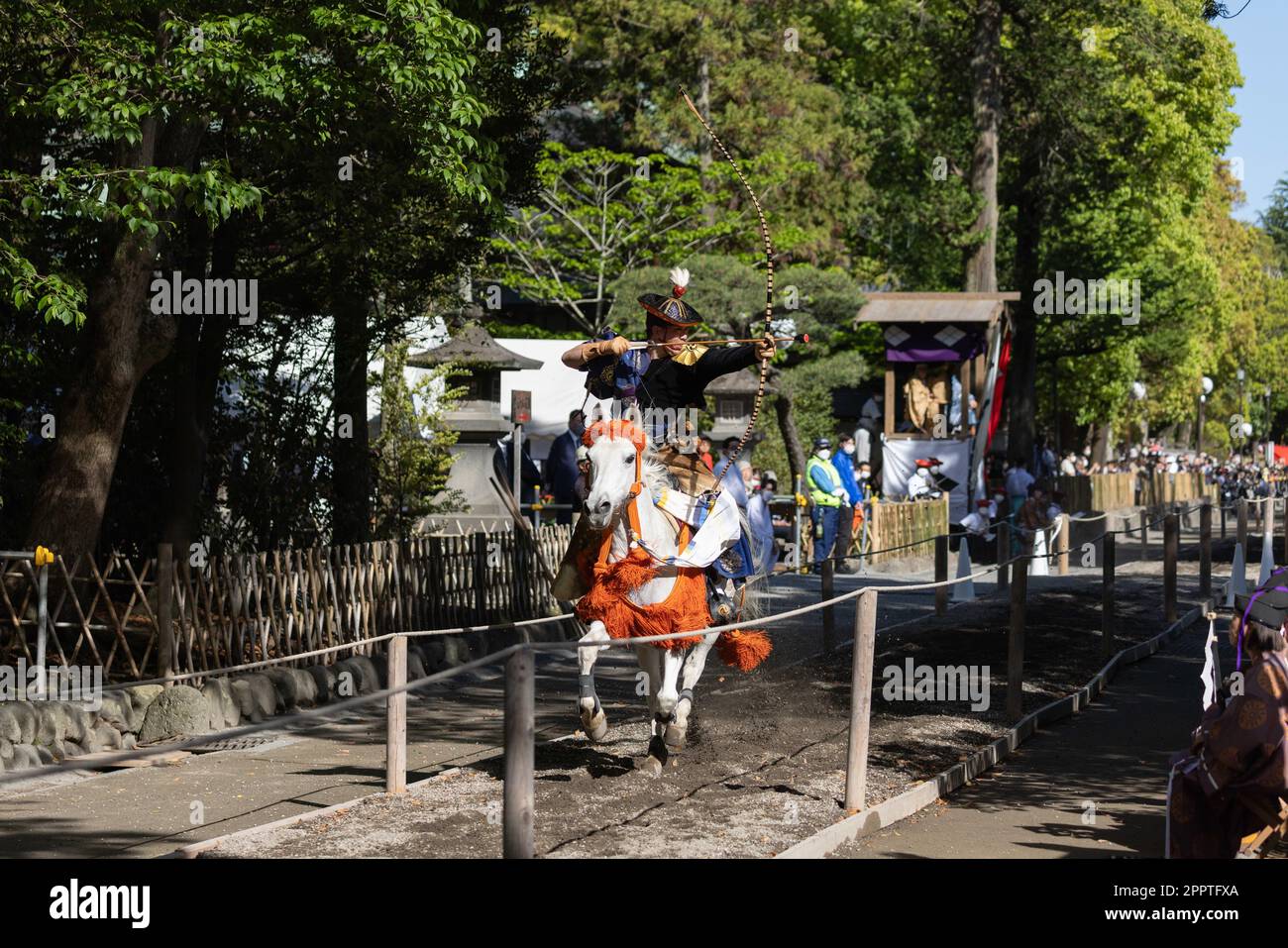 Yabusame (Japanese horseback archery) archer aims on target. 65th ...