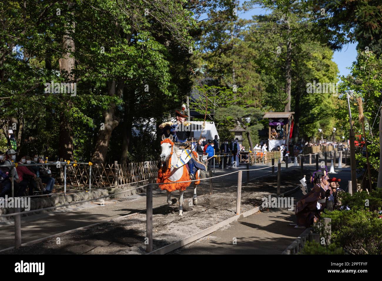 Yabusame (Japanese horseback archery) archer aims on target. 65th ...