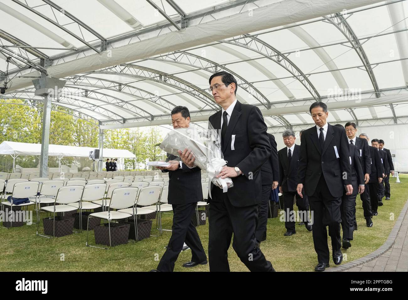 A sprit-consoling service is held near the site of the derailment accident in Amagasaki City ...