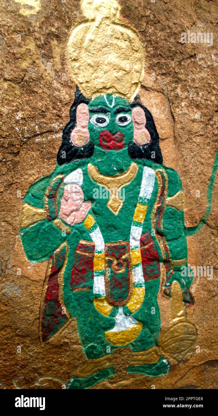 Hanuman painting on a rock Stock Photo - Alamy