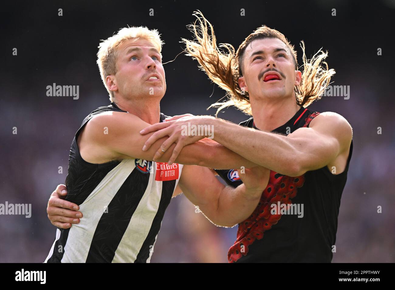 Billy Frampton of Collingwood (left) and Sam Draper of Essendon in ...