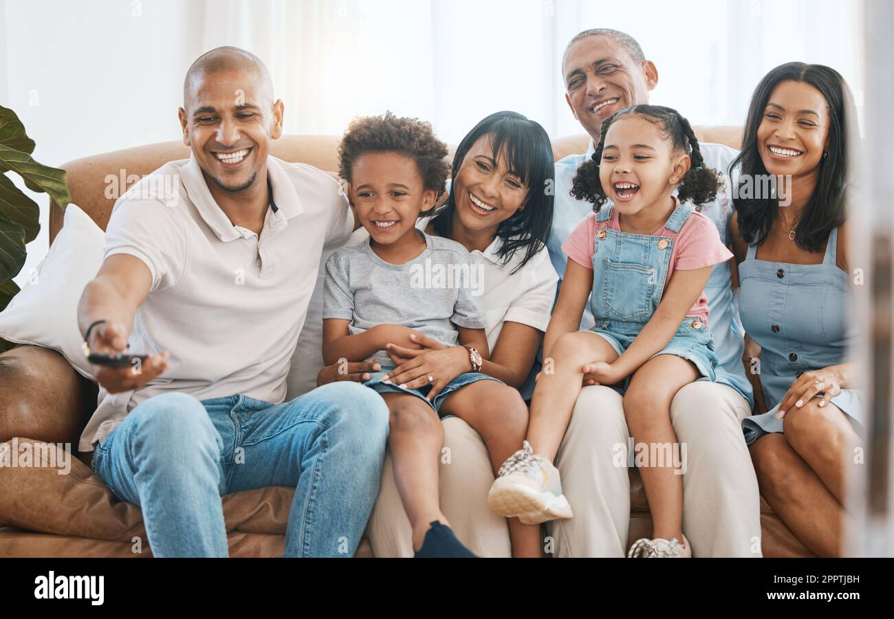 Big family, watching tv and laughing in home living room on sofa, bonding and having fun ...