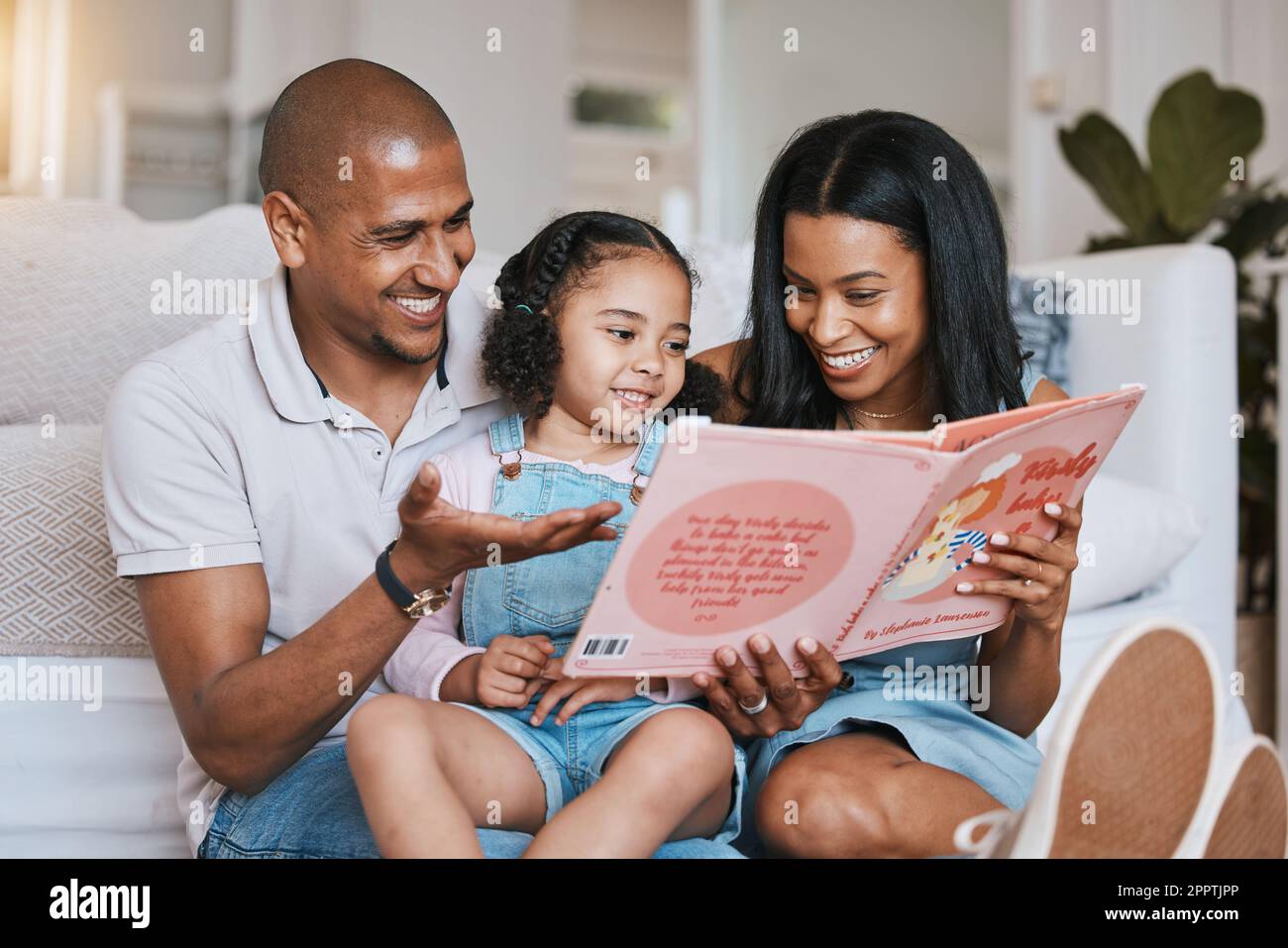 Parents, family and girl reading book in home, bonding and learning in ...