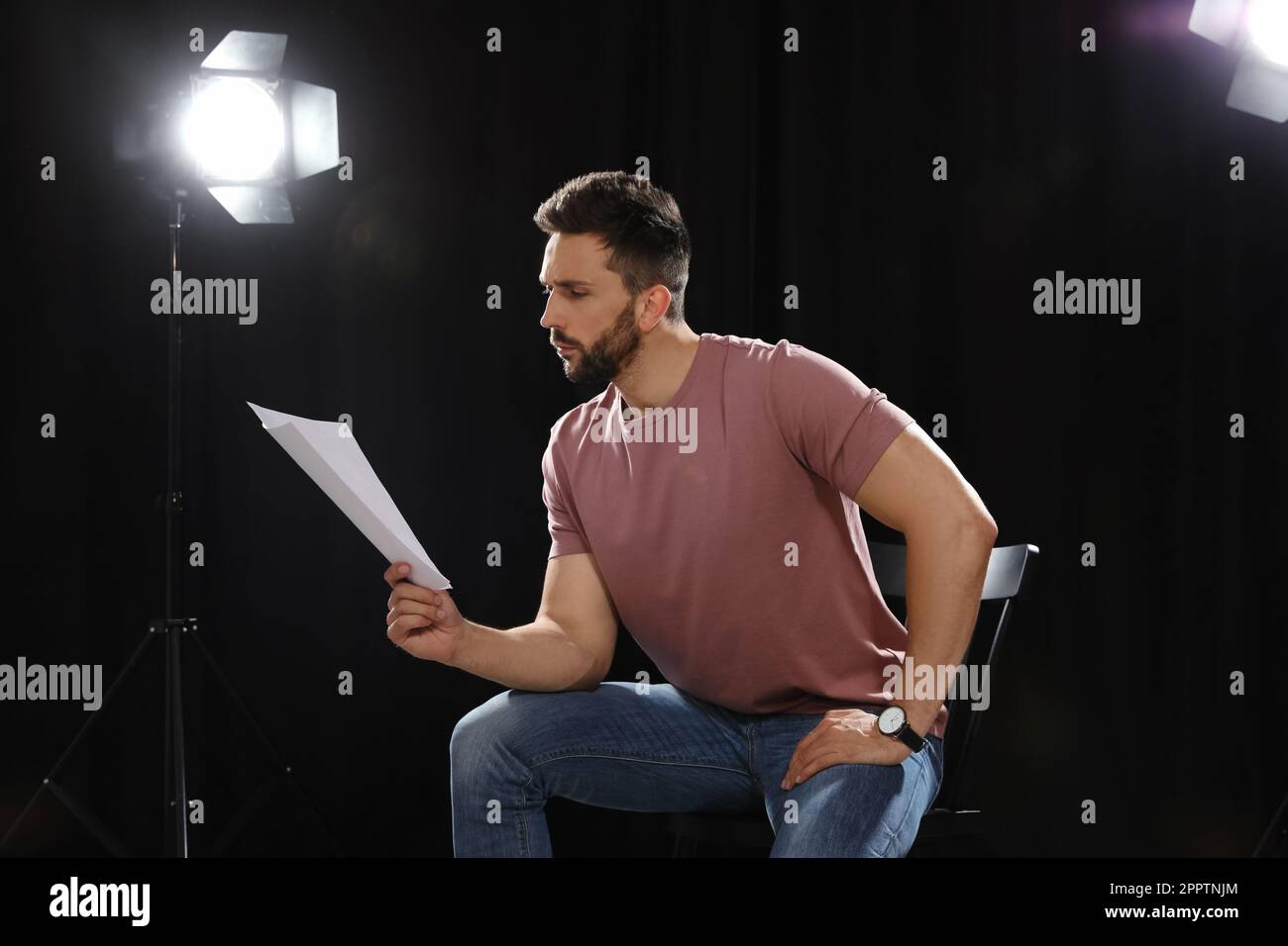 Professional actor reading his script during rehearsal in theatre Stock ...