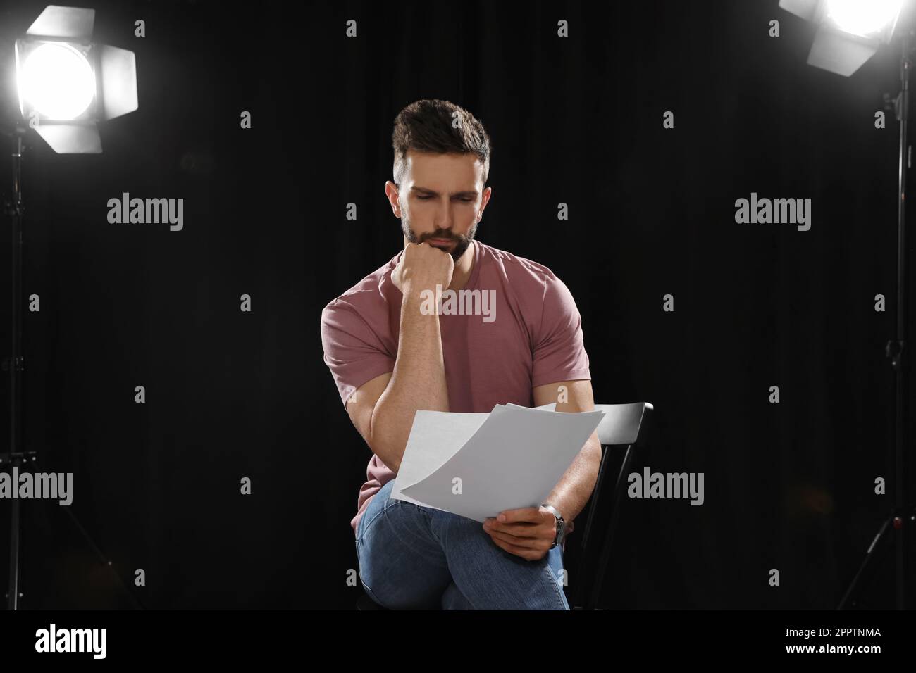 Professional actor reading his script during rehearsal in theatre Stock ...