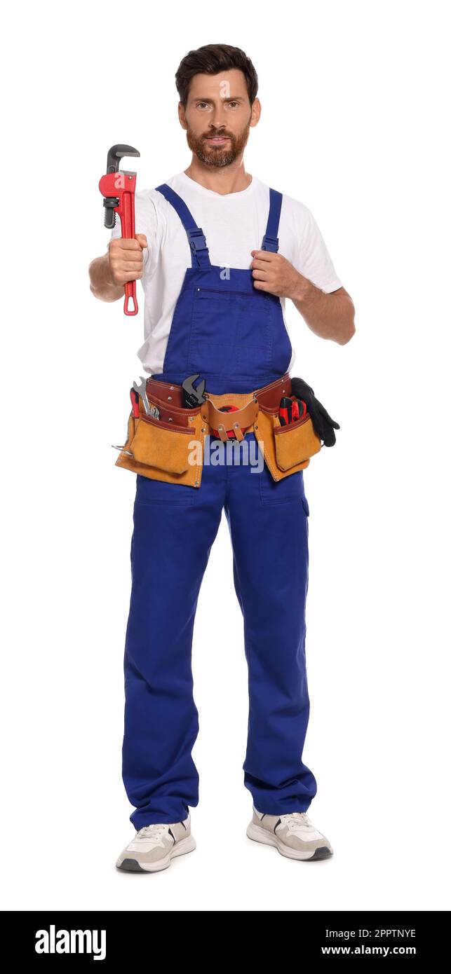 Professional plumber with pipe wrench and tool belt on white background ...