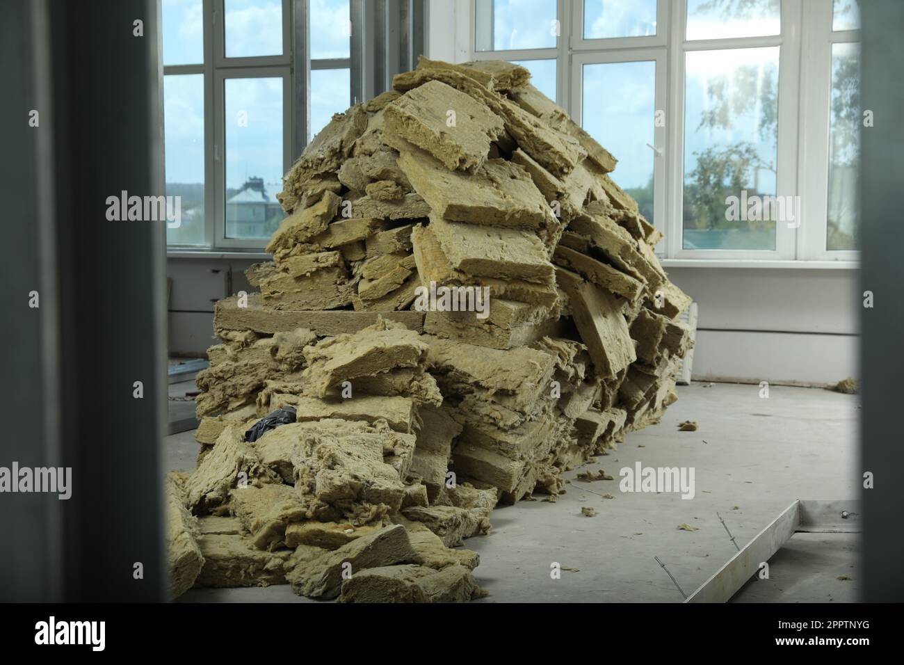 Heap of thermal insulation material in room Stock Photo - Alamy
