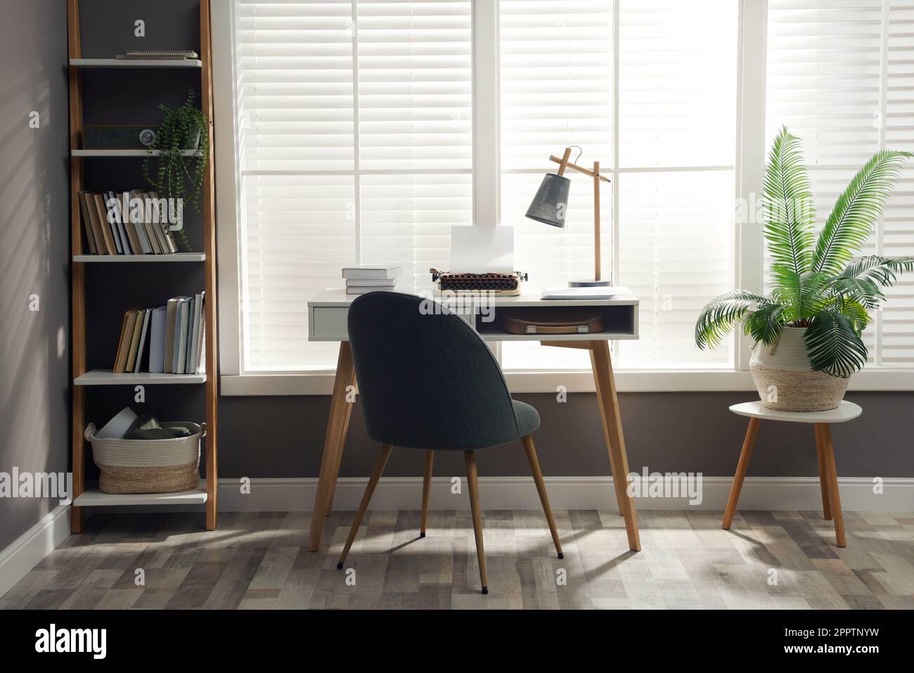 Comfortable writer's workplace interior with typewriter on desk in ...