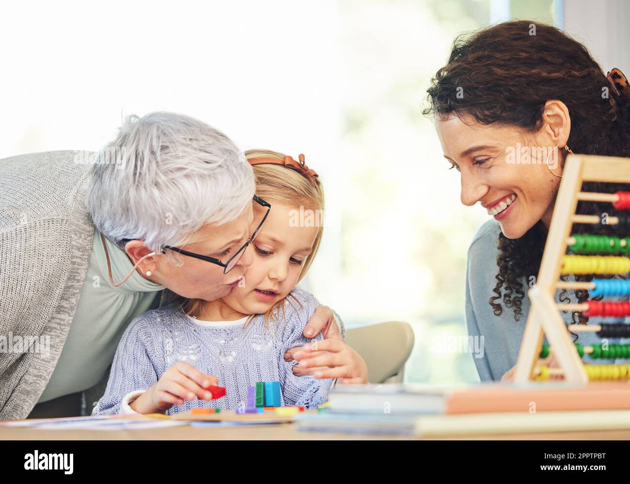 Grandmother, mom and girl learning in home with abacus for lesson ...