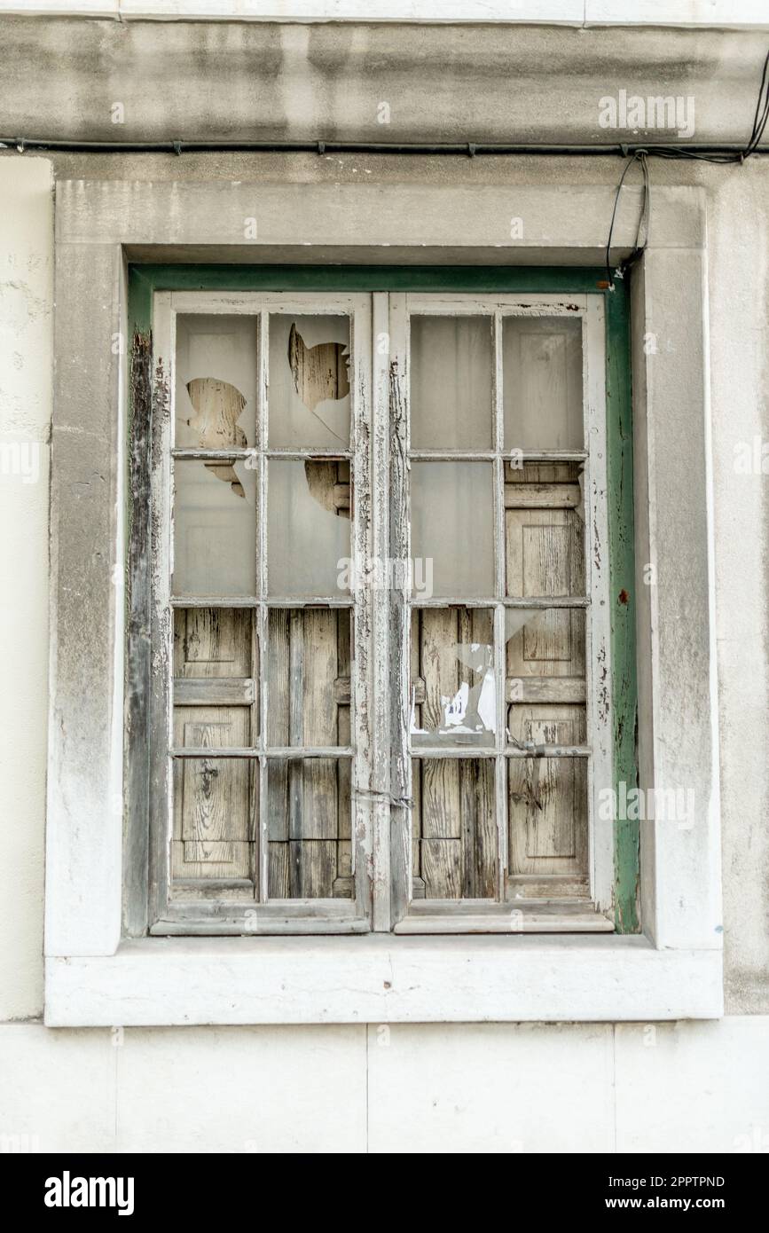 Old, broken window. Boarded up from the inside Stock Photo - Alamy