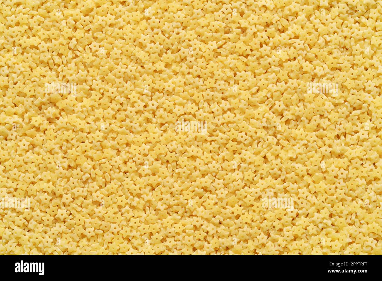 Small star shaped stelline pasta for soup texture or background Stock ...