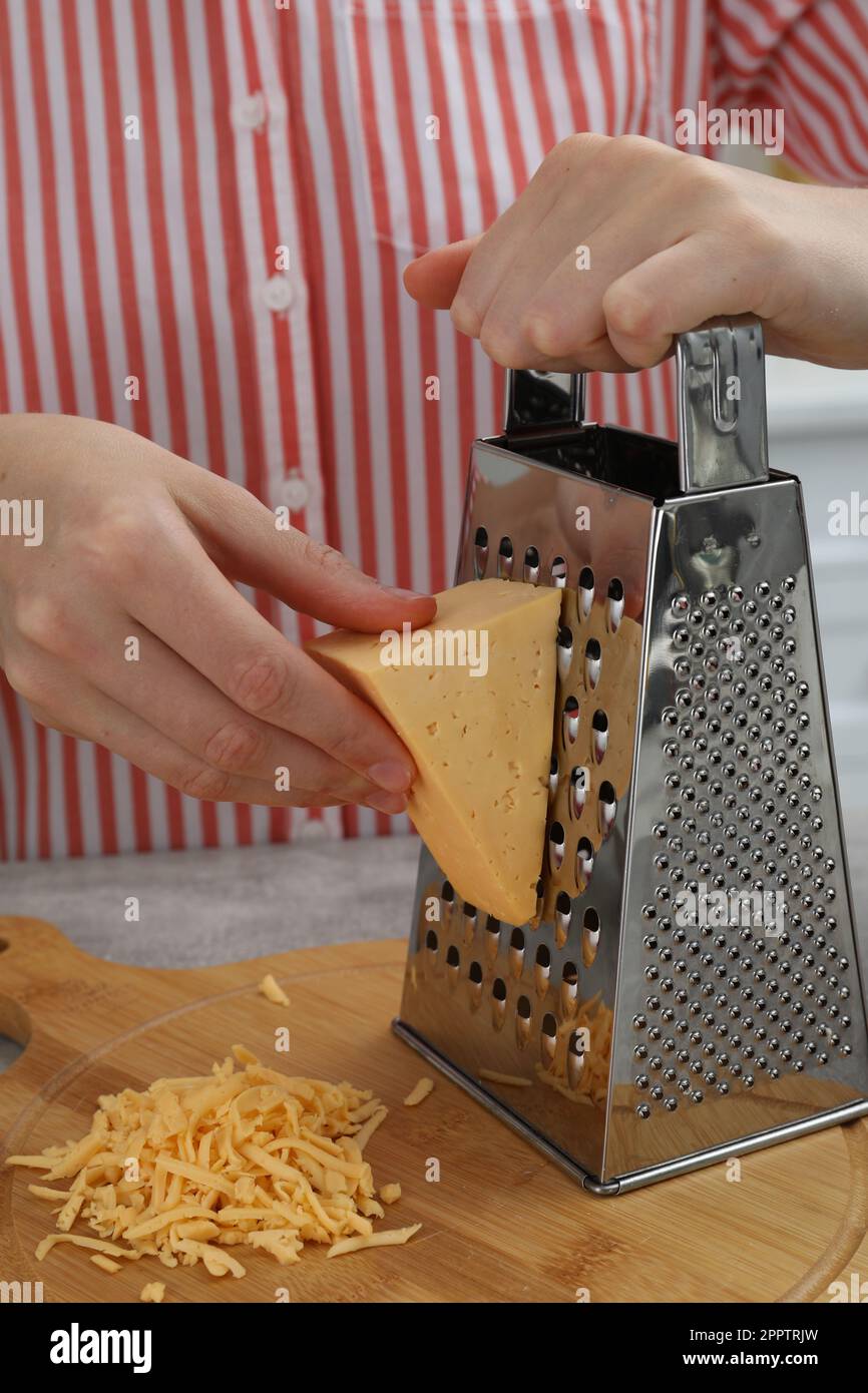 Grating cheese grater hands hi-res stock photography and images - Alamy