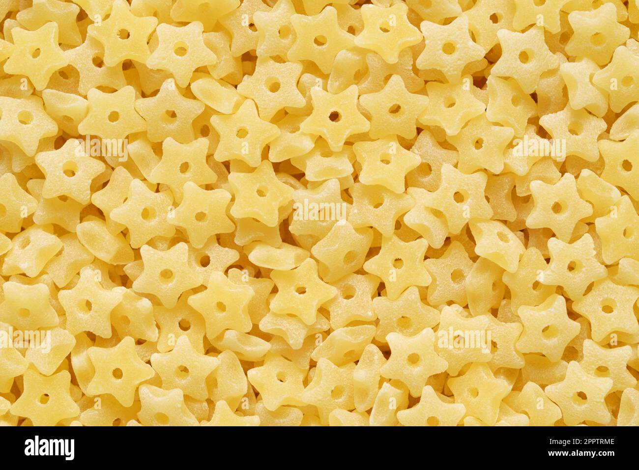 Small star shaped stelline pasta for soup texture or background Stock ...