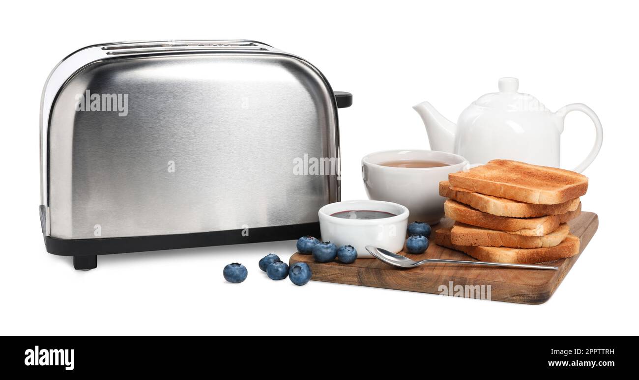 Toaster, bread with jam, blueberries and tea on white background Stock ...