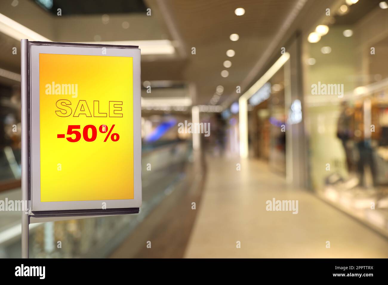 Advertising board with text SALE and 50 percent discount in shopping ...