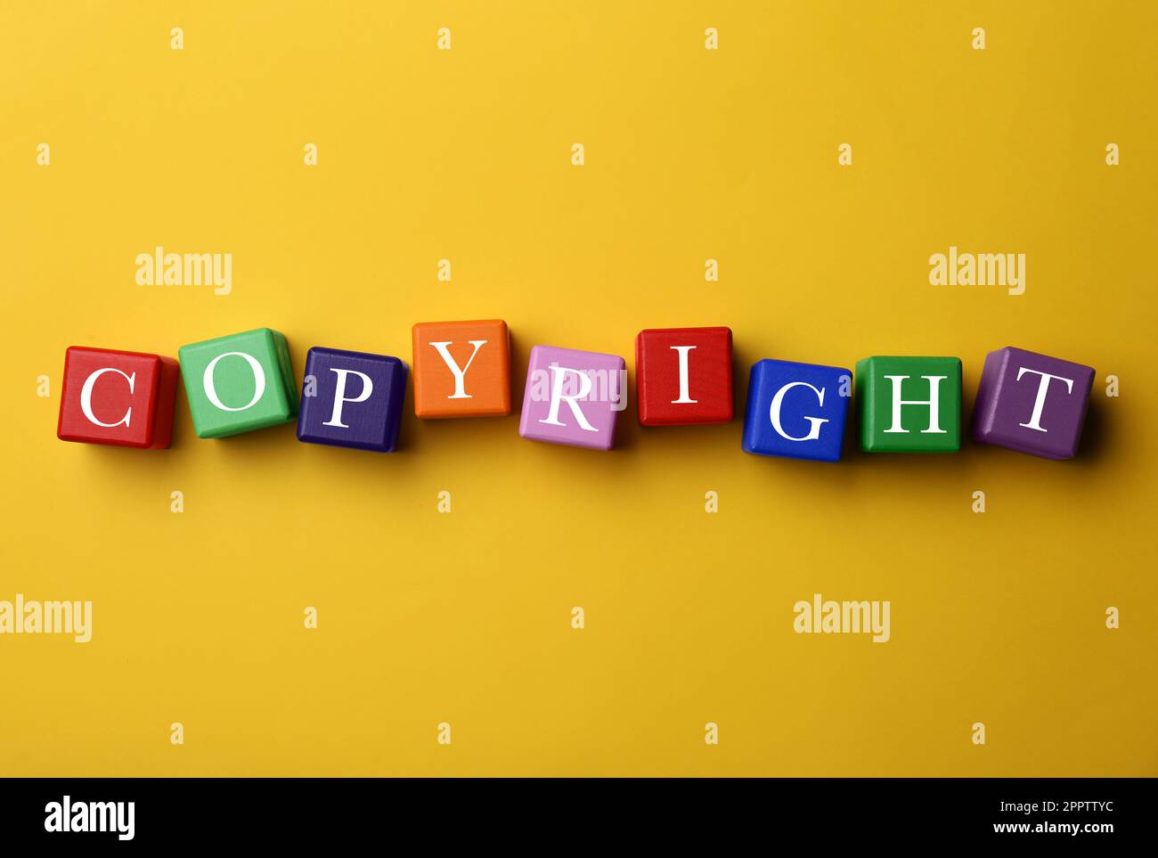 Plagiarism concept. Word Copyright made of color cubes on yellow ...