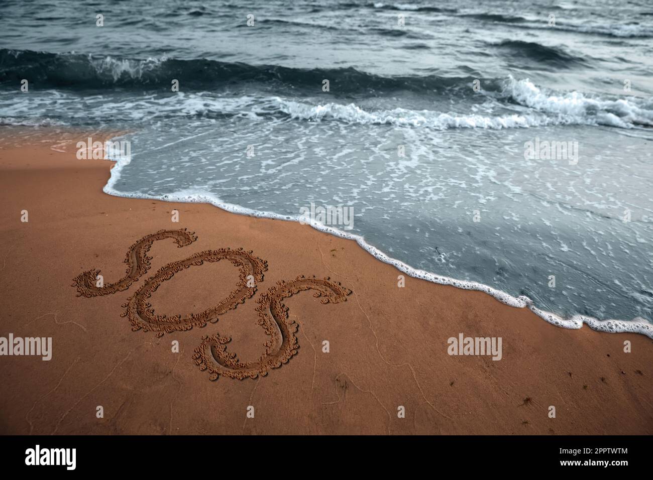 Sos message written on sand hi-res stock photography and images - Alamy