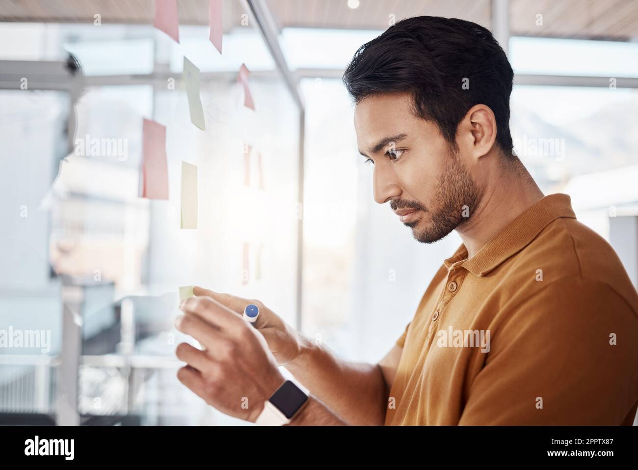 Business man, sticky note and planning on glass board, writing and ...