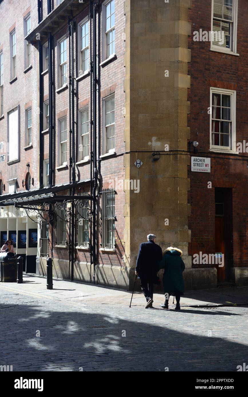 Elderly couple walking on Rupert Street in Soho, London Stock Photo - Alamy