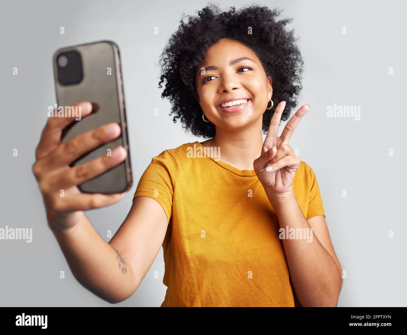 Peace sign, selfie and smile with woman in studio for social media ...