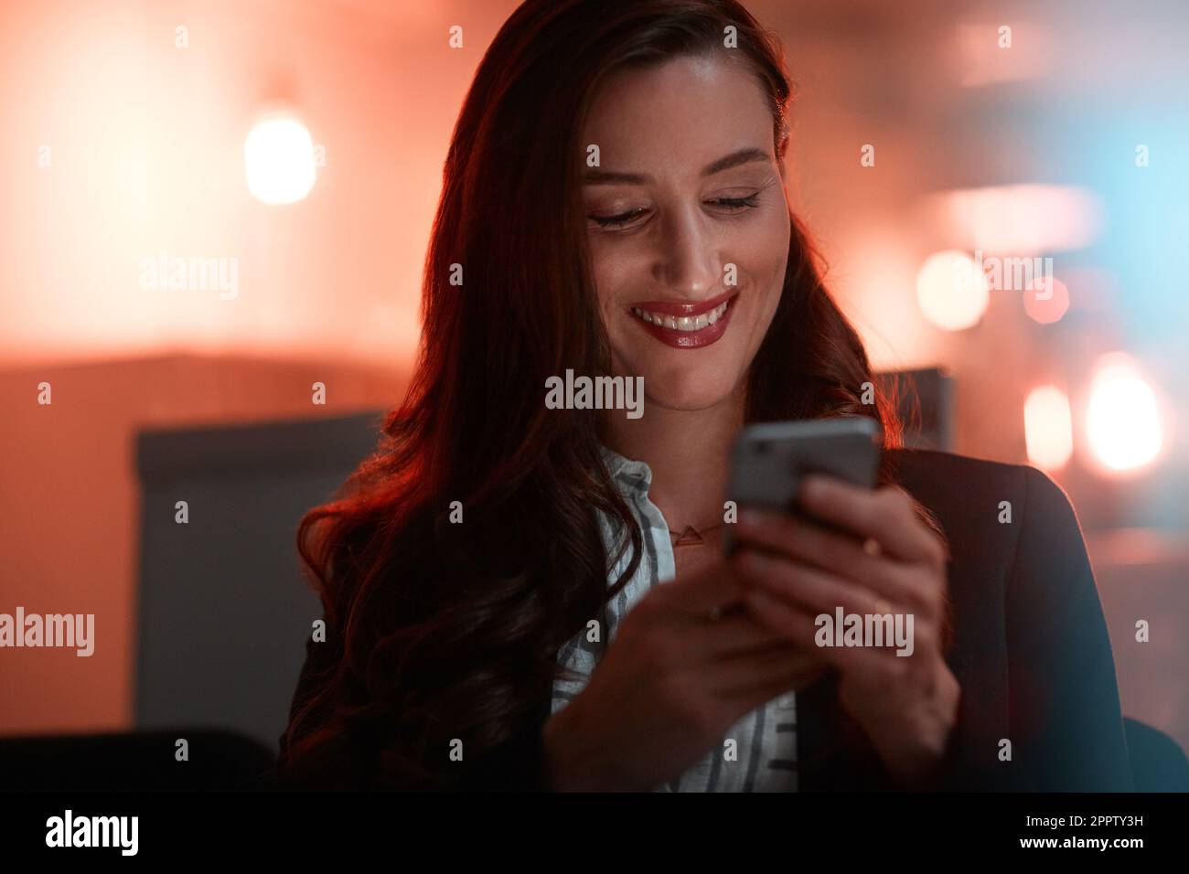 Connected to her clients around the clock. a businesswoman using a ...