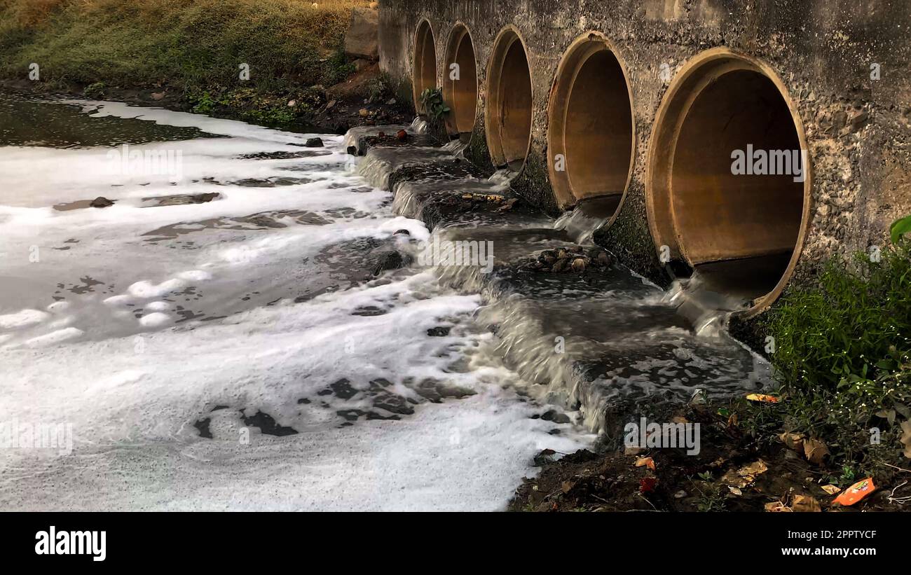 Sewage water flowing into river body and polluting the water and ...