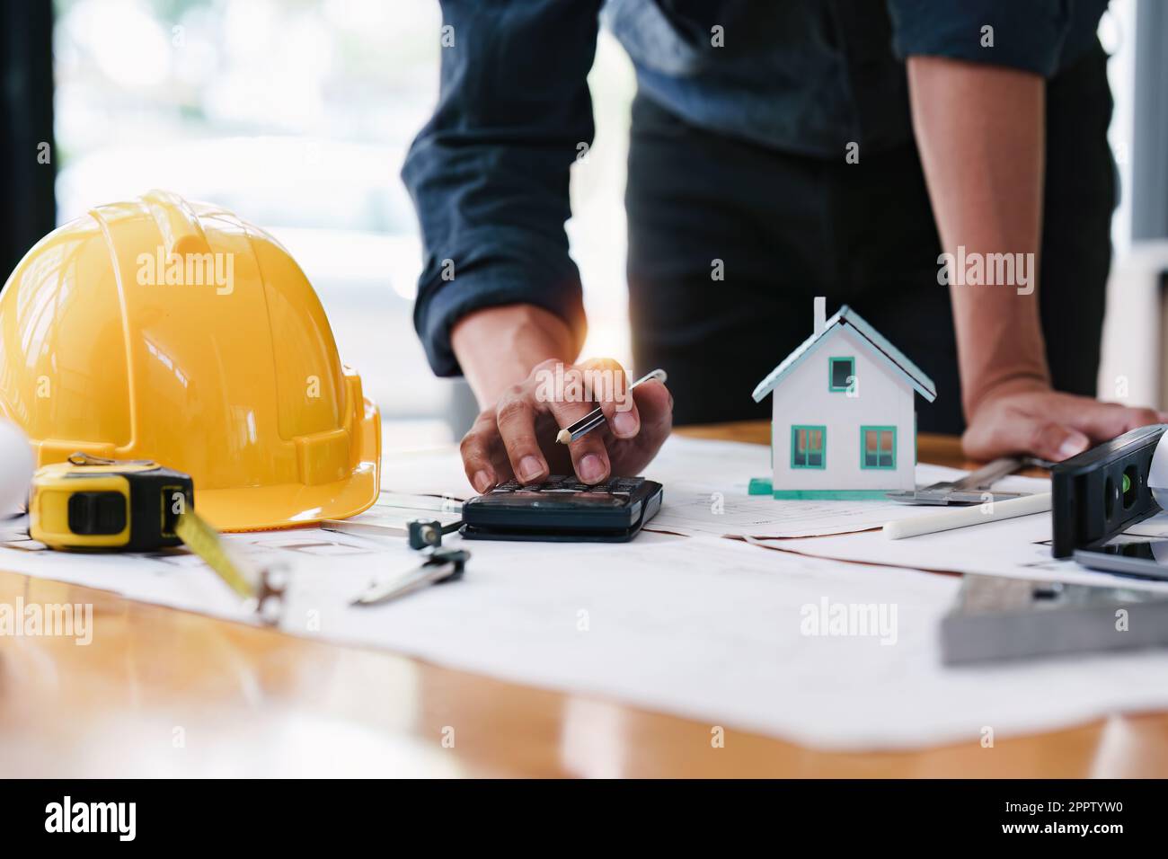 Architect working with blueprints for architectural plan, engineer ...