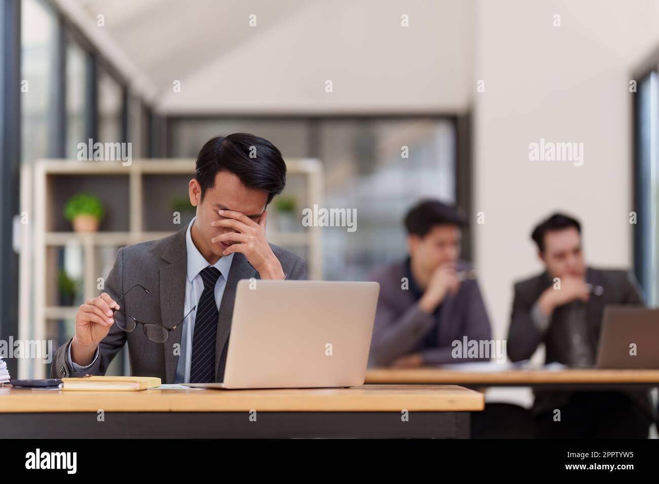Stressed business person working and research strategy on laptop and ...
