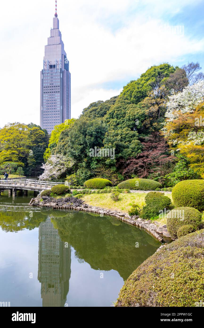Shinjuku Gyoen Park, April 2023, tall skyscraper building in Tokyo is ...