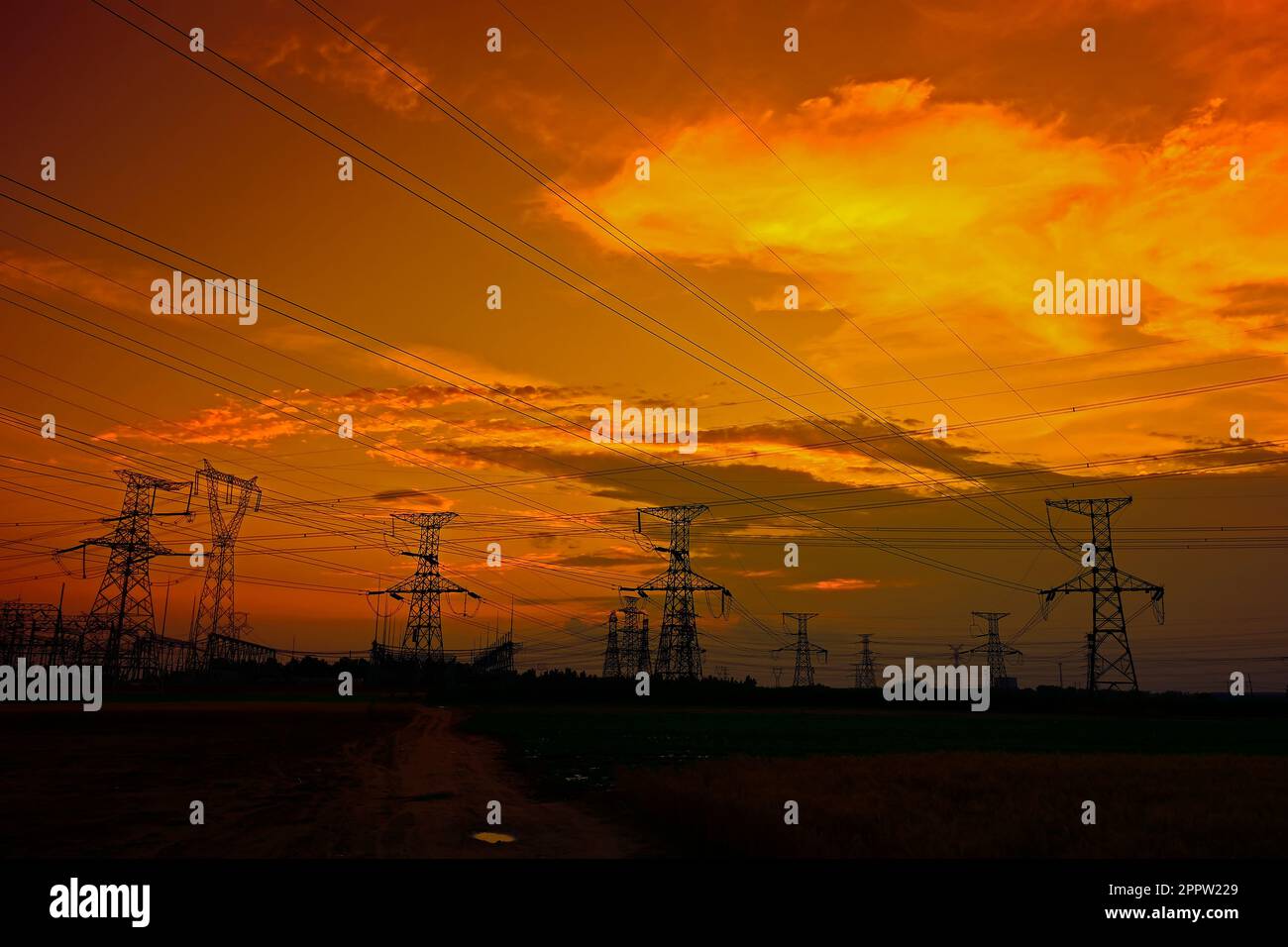 Electric tower, silhouette at sunset Stock Photo - Alamy